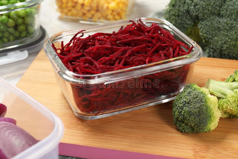 Containers with Cut Beetroot and Fresh Products on Table, Closeup. Food ...