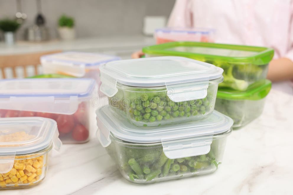 Containers with Different Fresh Products on White Marble Table in ...