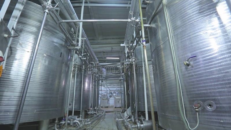 Containers for Liquids in a Food Factory. Industrial Interior. Working ...