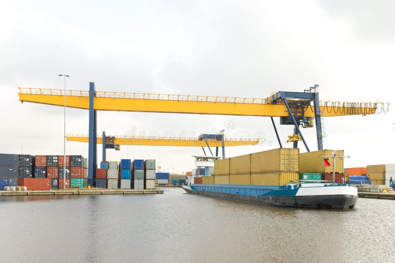 Containers on a small ship stock photo. Image of crane - 23420570