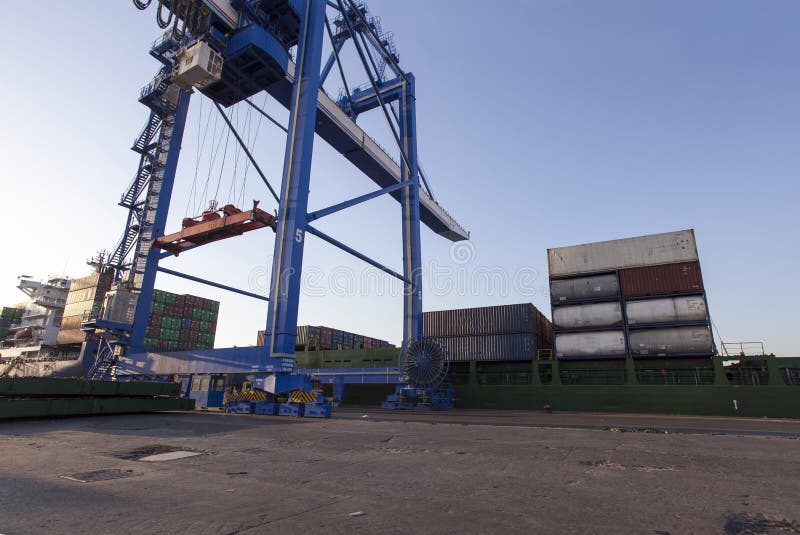 Containers under operation stock image. Image of hoist - 31944107