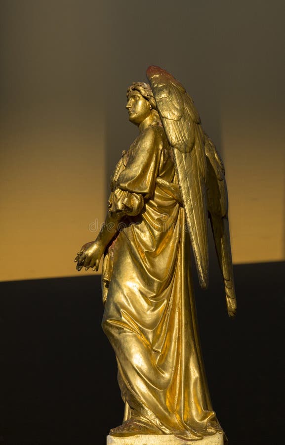 Contemplating Golden Angel Sculpture Stock Photo - Image of masterpiece ...