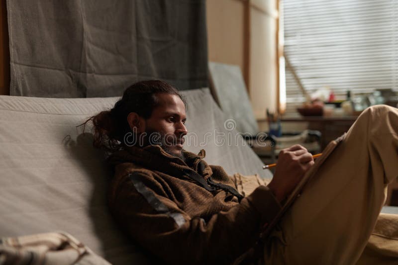 Contemplating Man Sitting in a Cozy Room Stock Photo - Image of cozy ...