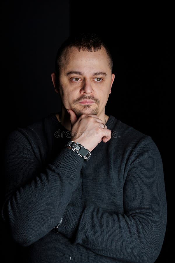 Contemplative Man in a Dark Setting Stock Image - Image of confidence ...