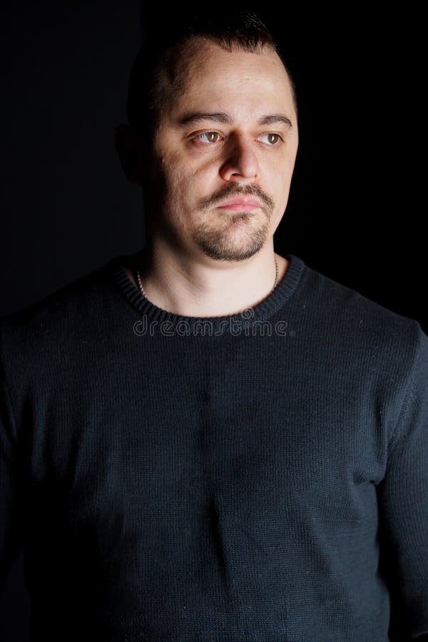 Contemplative Man in Dim Lighting Stock Photo - Image of thoughtful ...