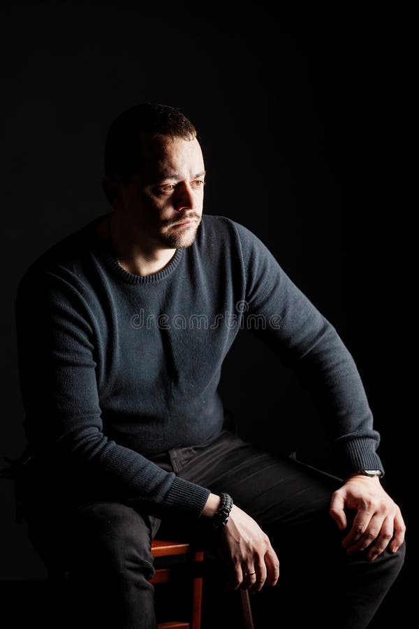 Contemplative Portrait of a Man in Low Light Stock Image - Image of ...