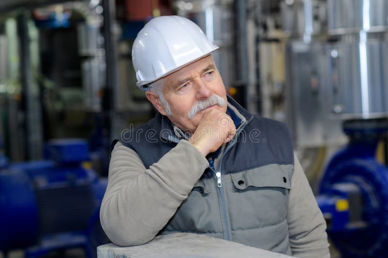 Contemplative Senior Man in Industrial Setting Stock Photo - Image of ...