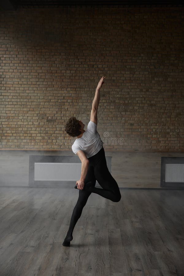 Ballet Male African American Ballet Dancer Stretching Leaning on a ...