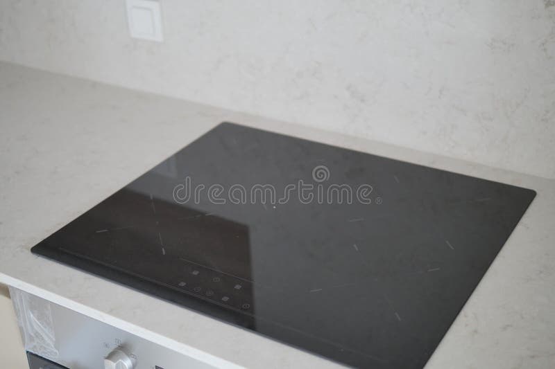 A Contemporary Black Induction Cooktop Set within an Elegant and ...