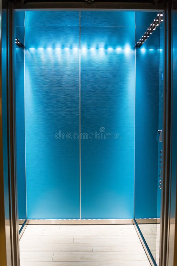 Contemporary Blue Elevator Interior with Metal Doors Stock Image ...