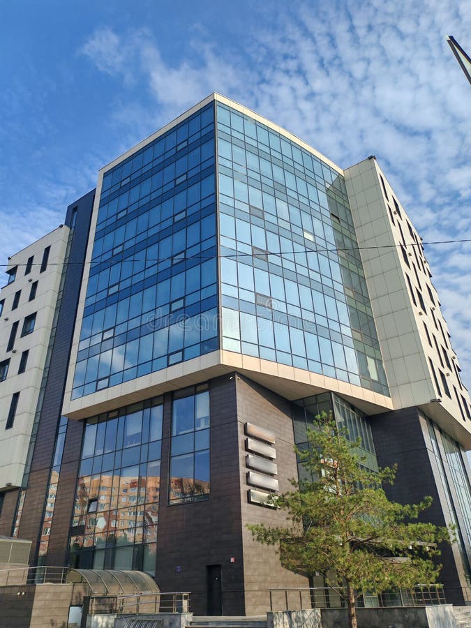 Contemporary Building with Sharp Angles, Glass Windows, and Light ...