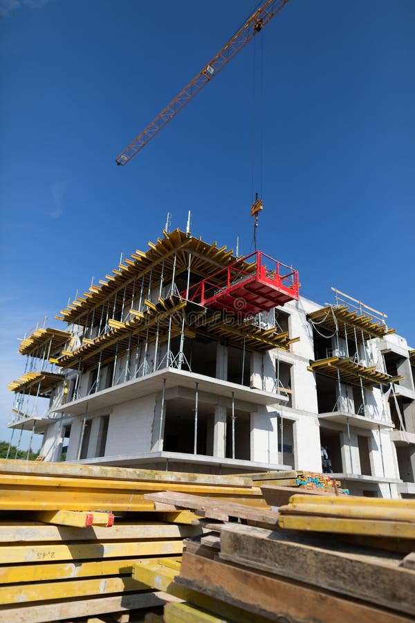 Contemporary Construction Site Featuring a Crane and Various Building ...