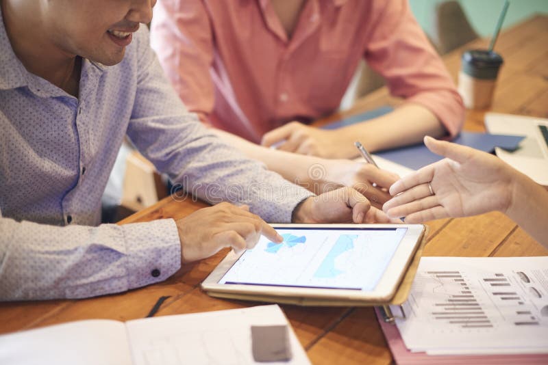 Contemporary Coworkers Using Tablet In Team Stock Image - Image of ...
