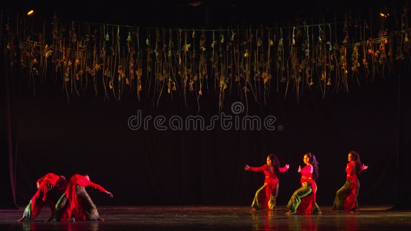 Dancers on a Dark Stage with Spotlight and Chandelier Backdrop Stock ...