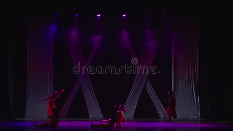 Contemporary Dance Performance on a Dark Stage with Dramatic Lighting ...