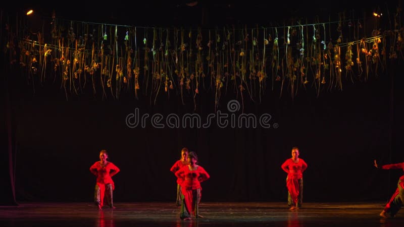 Contemporary Dance Performance on a Dark Stage with Dramatic Lighting ...