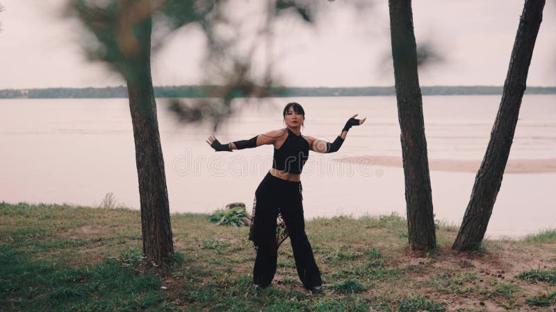 Contemporary Dancer in Black Clothes Dancing in the Sea Stock Footage ...