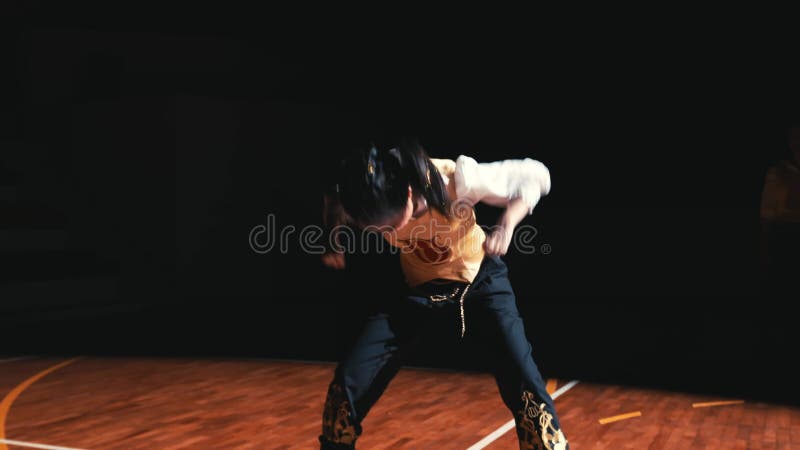 Contemporary Dancer in a Dynamic Pose on a Dark Stage, Spotlight Effect ...