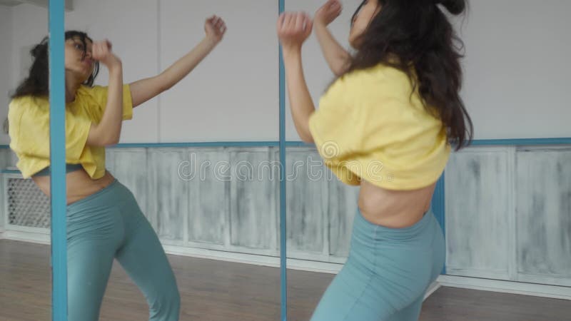 Contemporary Dancer Performs Expressive Movements in Front of a Mirror ...