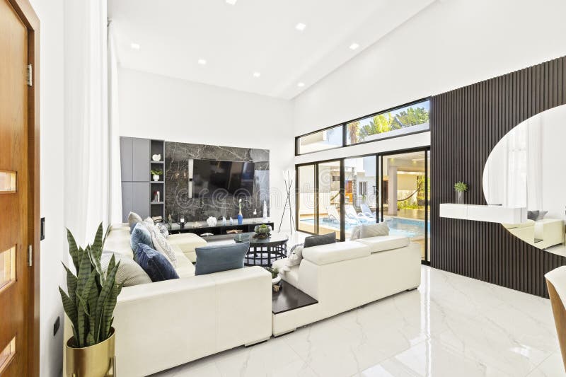 Contemporary Living and Dining Area with Expansive Windows Overlooking ...