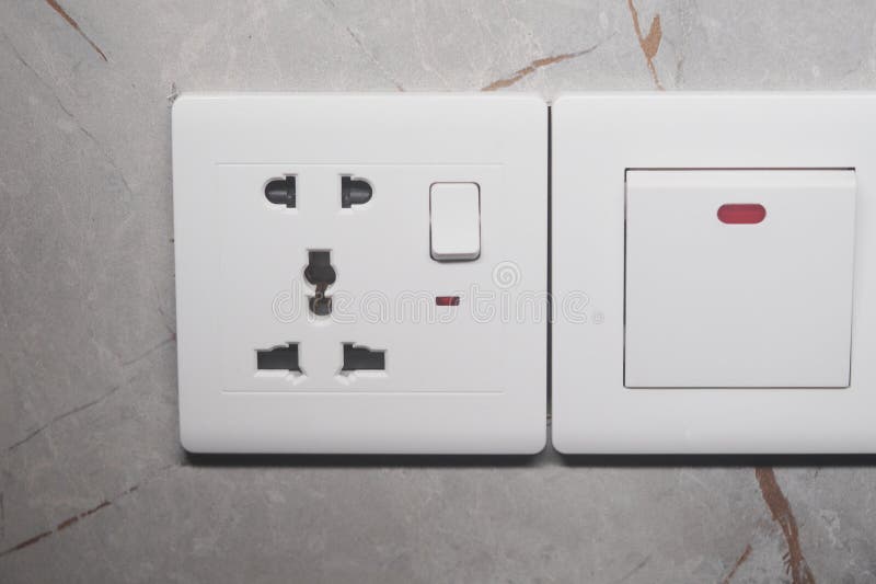 A Contemporary Modern Electrical Power Outlet and Switch Installed on ...