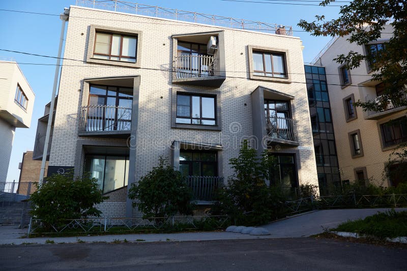 A Contemporary Multi-family Building Showcases Distinct Architectural ...