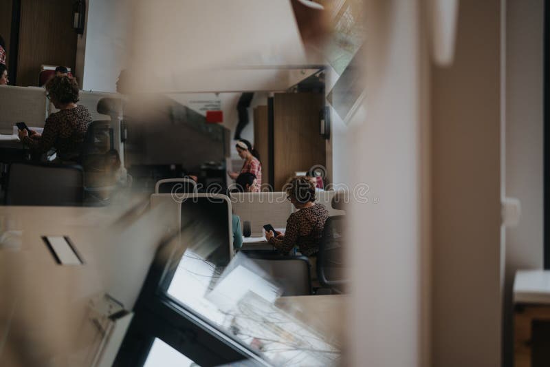 Contemporary Office Space with Employees Engaged in Work by Window ...