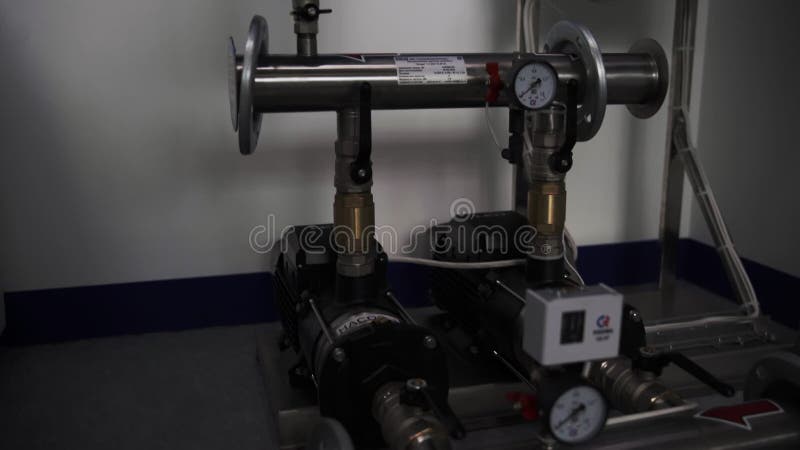 Contemporary Plunger Pump with Engine and Pressure Meter Stock Footage ...