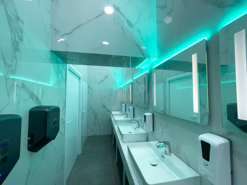 Modern Restroom Interior with Marble Walls and Neon Lighting Stock ...