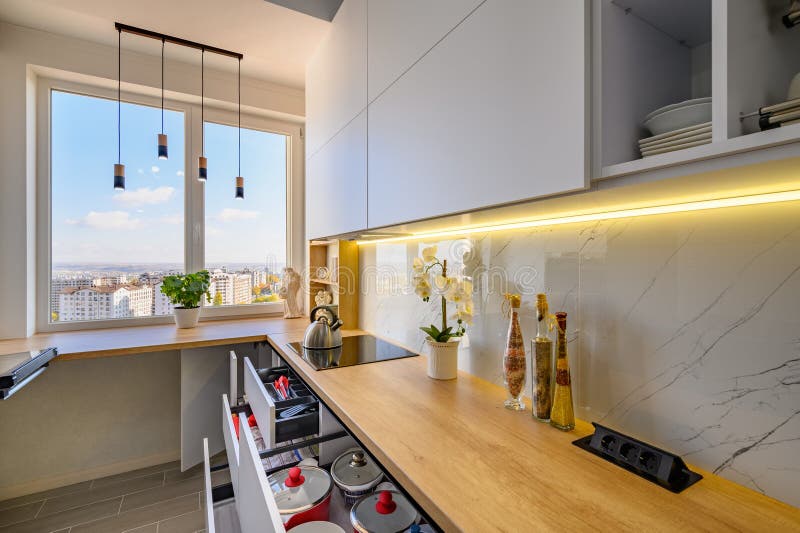 A Contemporary White Kitchen with Drawers Extended Stock Photo - Image ...