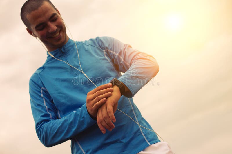Content Athlete is Looking at Smart Watch Stock Image - Image of clock ...