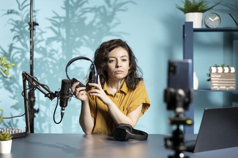 Tech Expert Promoting Music Listening Device, Filming with Phone Stock ...