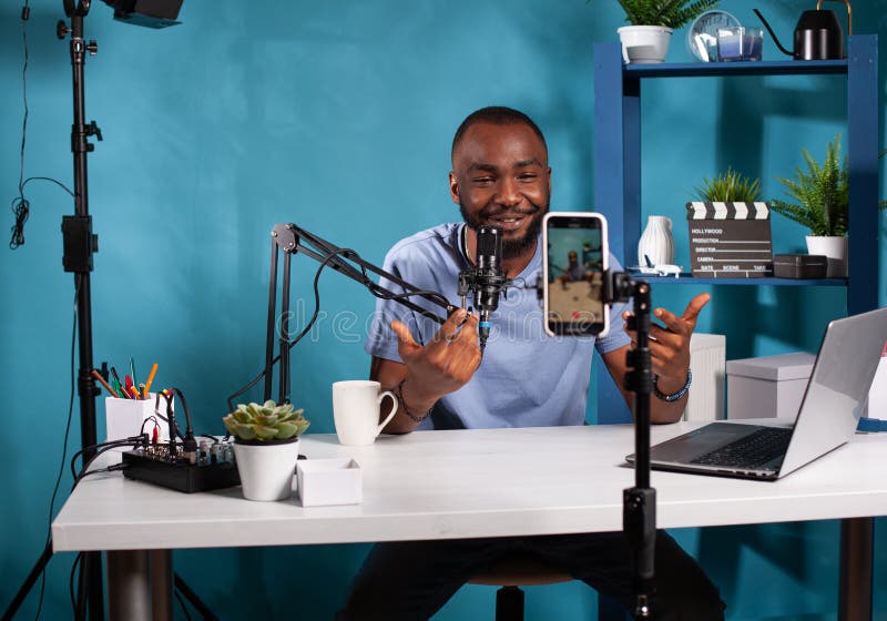 Content Creator Interacting with Fanbase in Studio Looking at Live ...