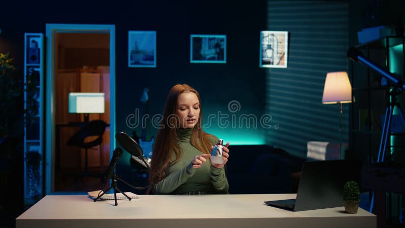 Content Creator Presenting Light Bulb in Home Studio Stock Footage ...