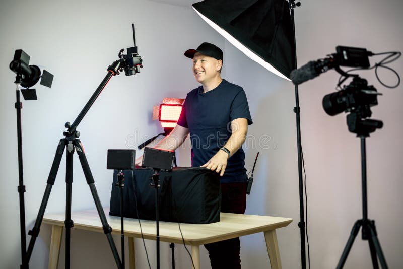 A Content Creator Unboxing in Front of His Cameras in His Studio Stock ...