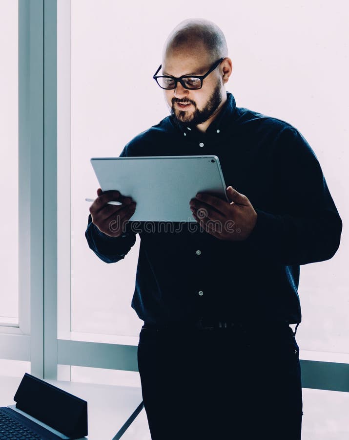 Content Man with Tablet in Modern Office Stock Image - Image of monitor ...