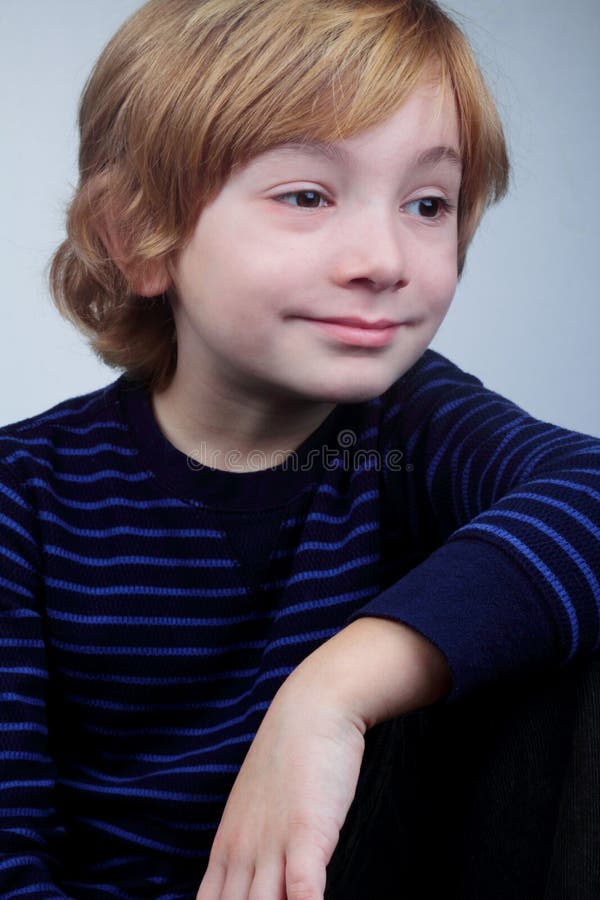Contented 6 year old Kid stock photo. Image of sitting - 22937016