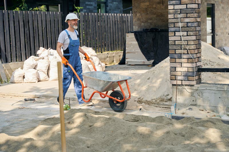 Skilled Contractor Engaged in Construction Activity on Site Stock Photo ...