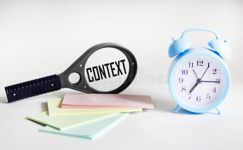 CONTEXT Text on Magnifying Glass and White Background with Clock and ...