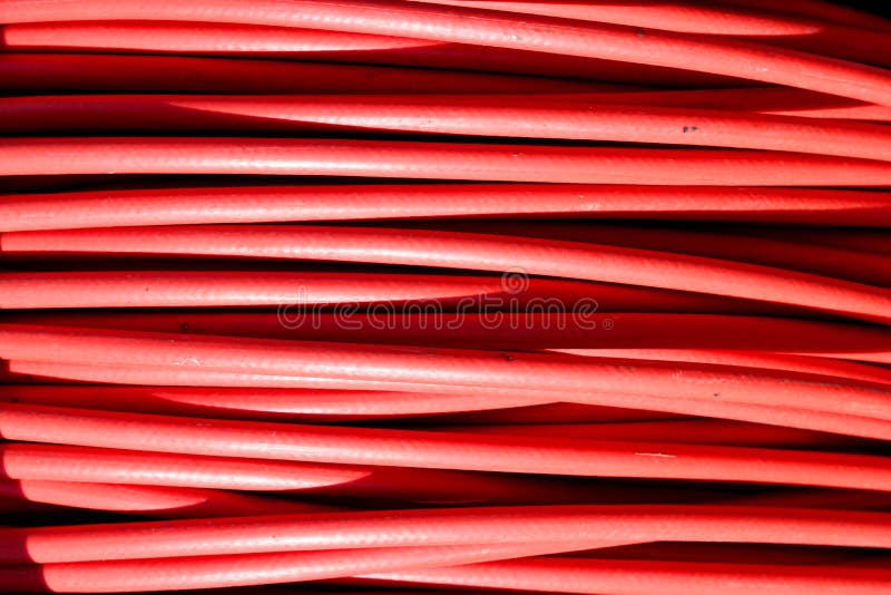 A Continuous Coil of Red Thick Cable on the Coil. Stock Photo - Image ...