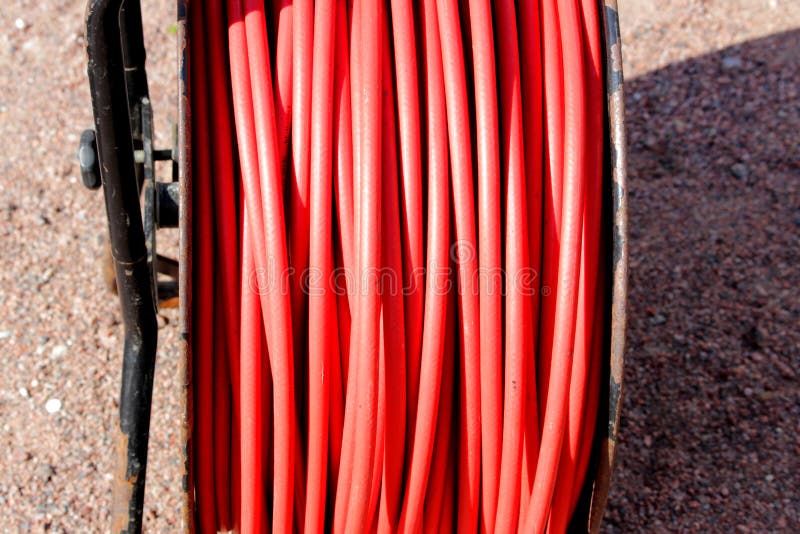 A Continuous Coil of Red Thick Cable on the Coil. Stock Photo - Image ...