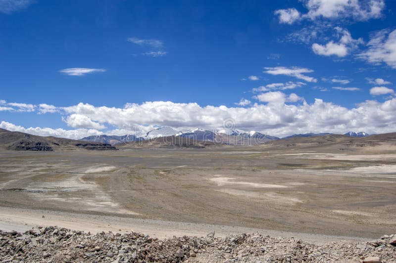 Continuous Mountains and Barren Plateau Meadows Under the Blue Sky and ...