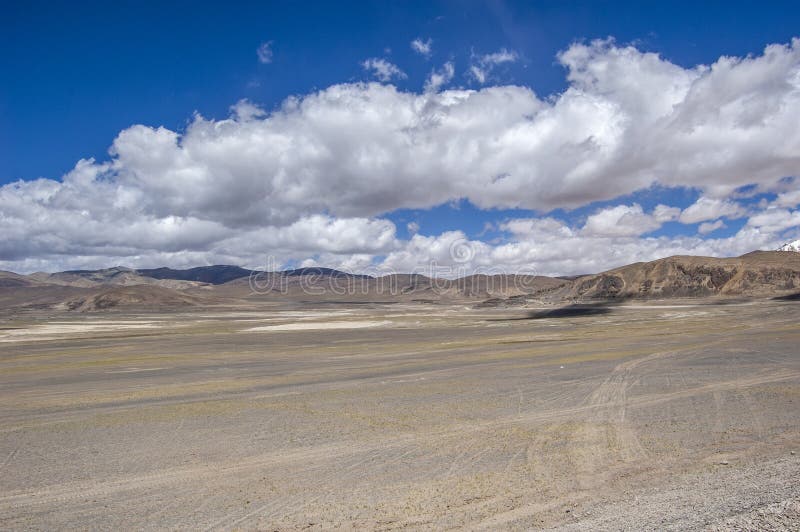 Continuous Mountains and Barren Plateau Meadows Under the Blue Sky and ...