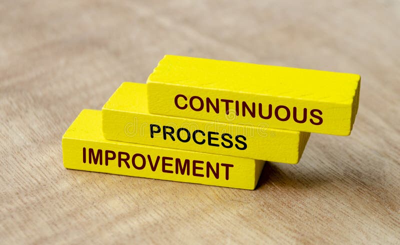 Continuous Process Improvement Text on Yellow Wooden Blocks. Business ...