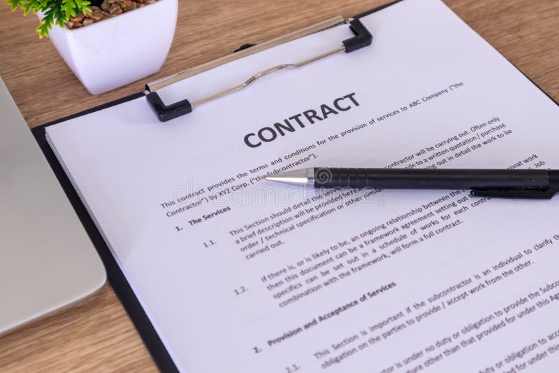 Contract Documents on the Wooden Table with Pen and Laptop Stock Image ...