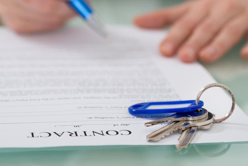 Contract with Key on Desk stock image. Image of apartment - 222645507