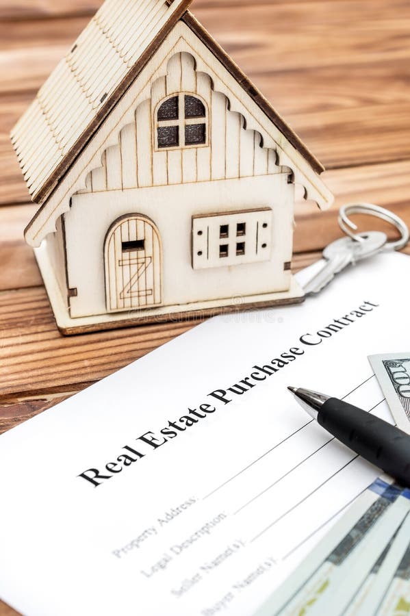 Contract for Purchase House with Model of House and Money on the Table ...