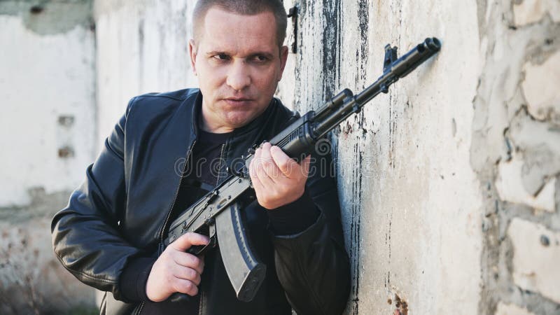 Man with automatic rifle stock image. Image of evil - 116811253
