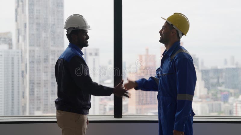 Contractor and Architect Talking and Consulting on Construction Site ...