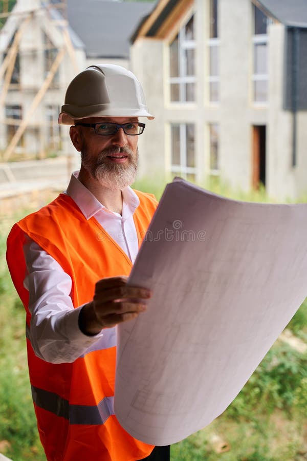 Construction Foreman Using Blueprints on Building Site Stock Image ...